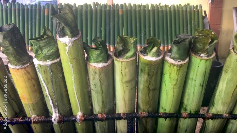 Lemang cooking, type of bamboo rice and made of glutinous rice, coconut ...