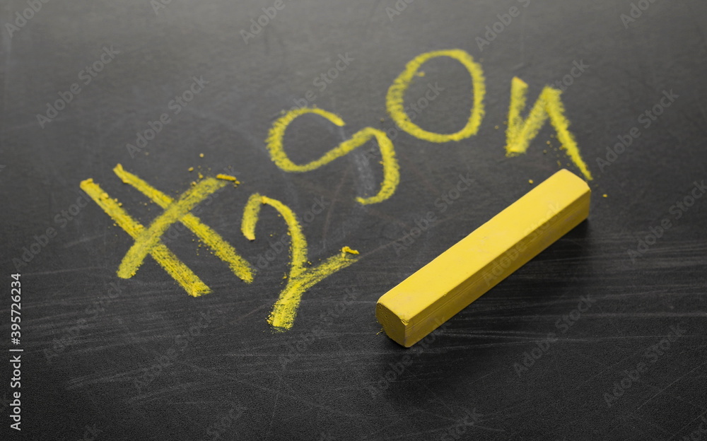 Sulfuric acid chemistry formula H2SO4 written on black chalkboard ...