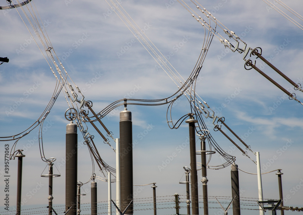 Electric power transmission lines in the evening. High voltage ...