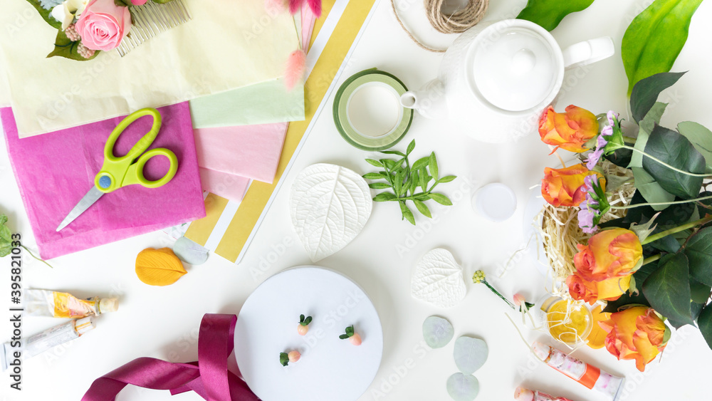 The working table of a florist designer who is engaged in hand-made ...
