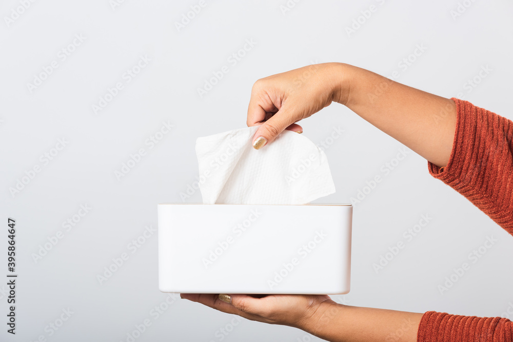Young woman flu she using hand taking pulling white facial tissue out ...