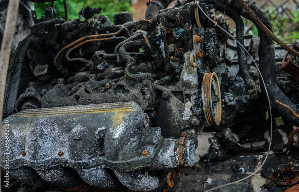 Burnt out car engine interior.old rusty car engine after a fire, burnt ...