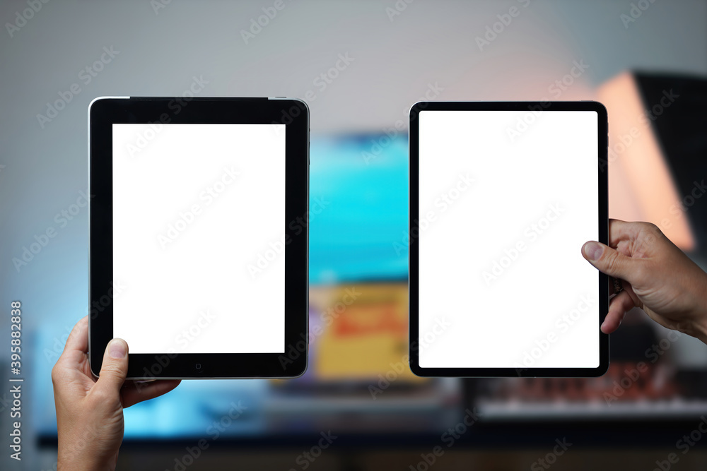 Person compares two tablets. Old and new. Screens mockups Stock Photo ...
