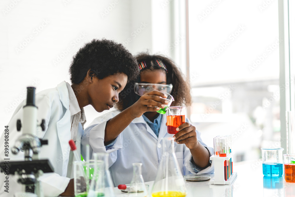 Two african american cute little boy and girl student child learning ...
