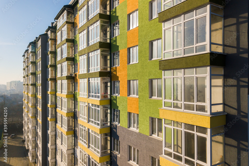 Aerial view of a tall residential apartment building with many windows ...