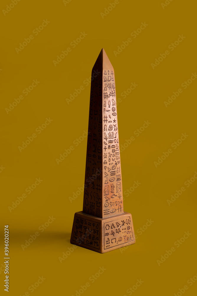 Egyptian obelisk with yellow background, symbol of power Stock Photo ...