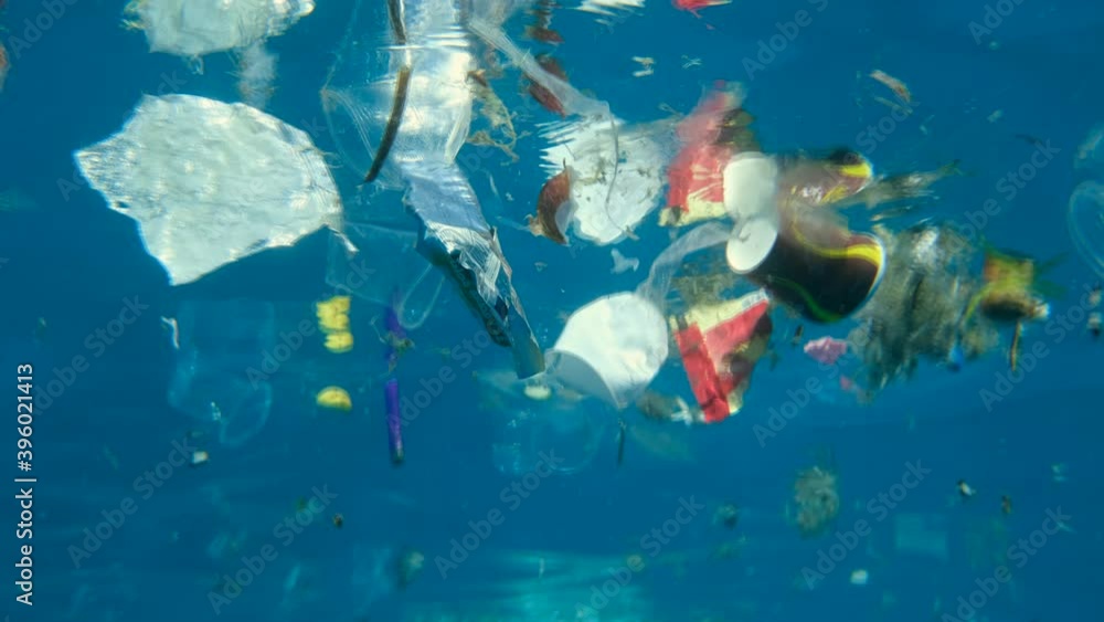 Closeup of plastic pollution of the Ocean. A lot of plastic debris ...
