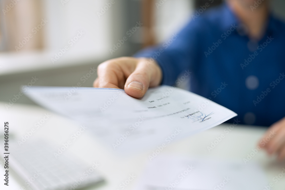 Handing Employee Payroll Cheque. Security Check Stock Photo | Adobe Stock