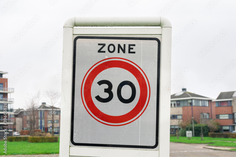 Sign with "Zone 30" indicating the speed limit in the specific area ...