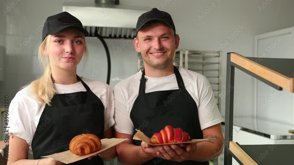 Vidéo Stock Portrait of two good looking young smiled male and female ...