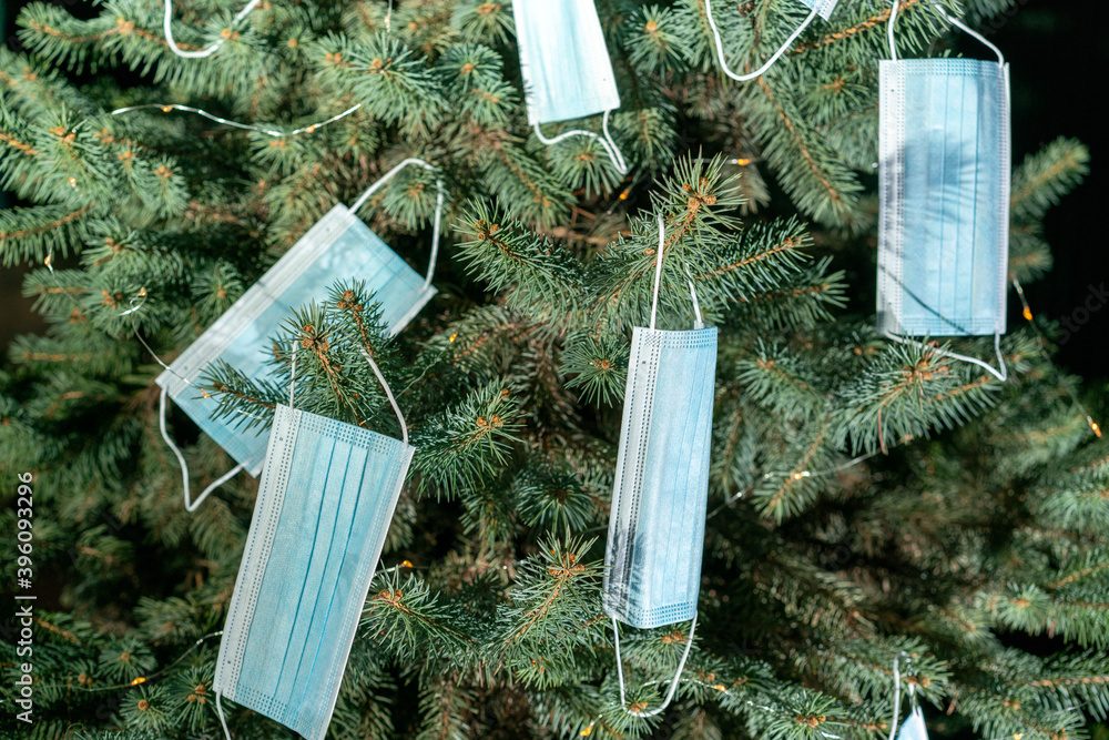 Christmas tree decorated with medical disposable medical masks ...