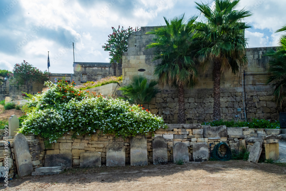 Gravestones and trees at the Msida Bastion Historic Garden, Formerly ...