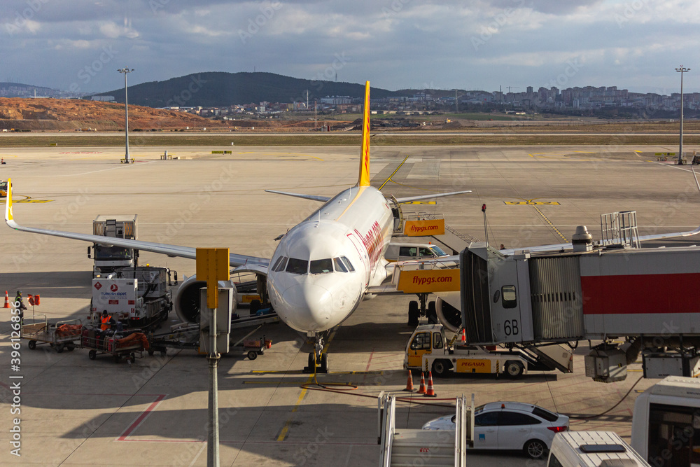 Airbus A320 type airliner parked in service area with ambulift ...