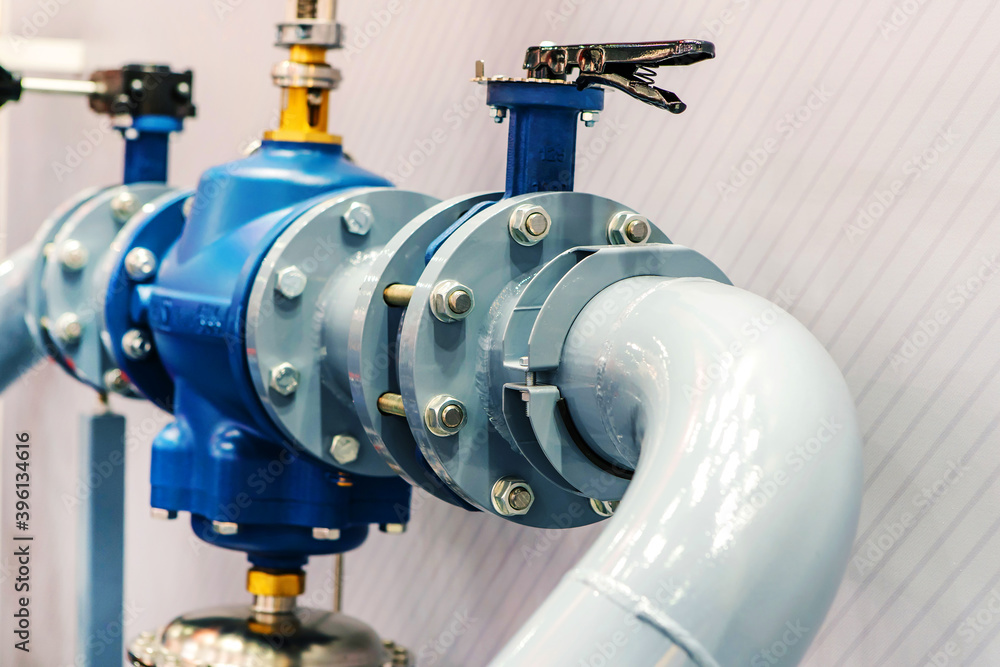 Large diameter pipe with valves and connection bolts in an industrial ...