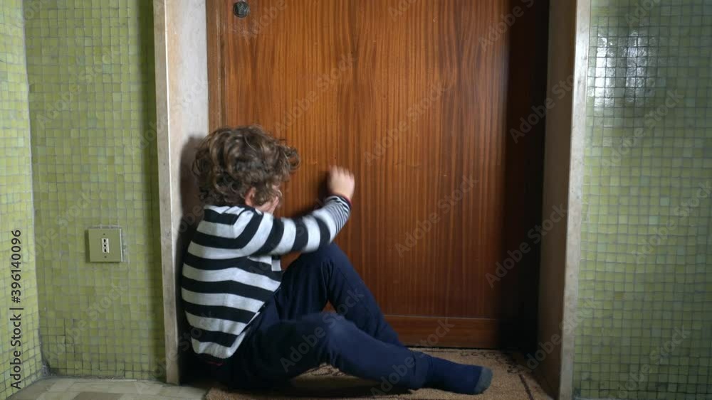 sad upset boy sitting in corner lifestyle . Child punished sitting ...