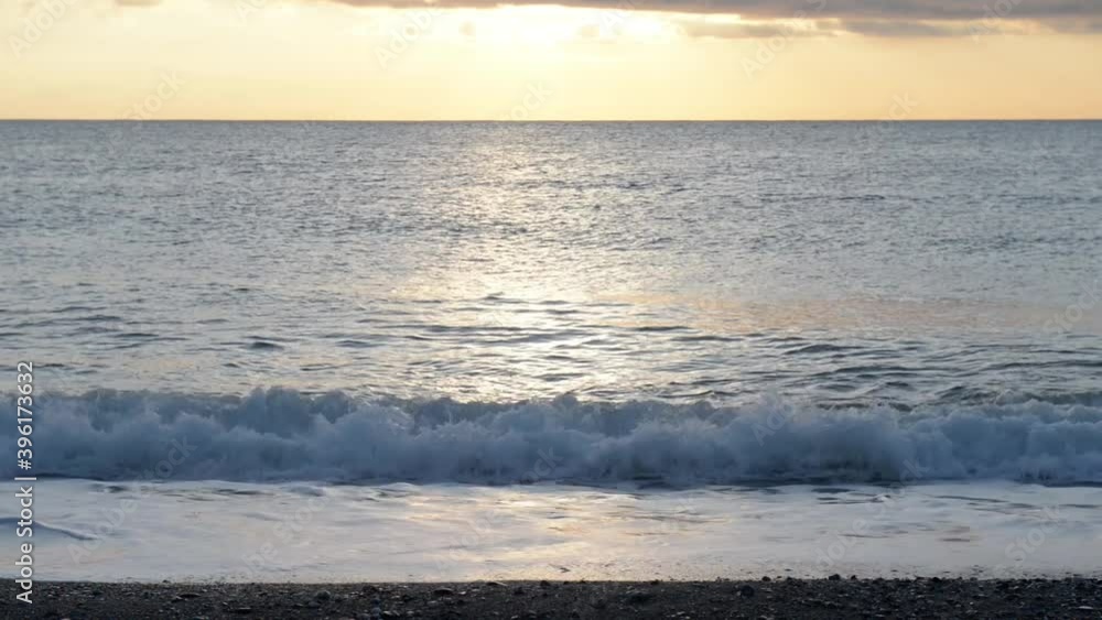 the first light of the day, when the sun rises from the clouds and the ...