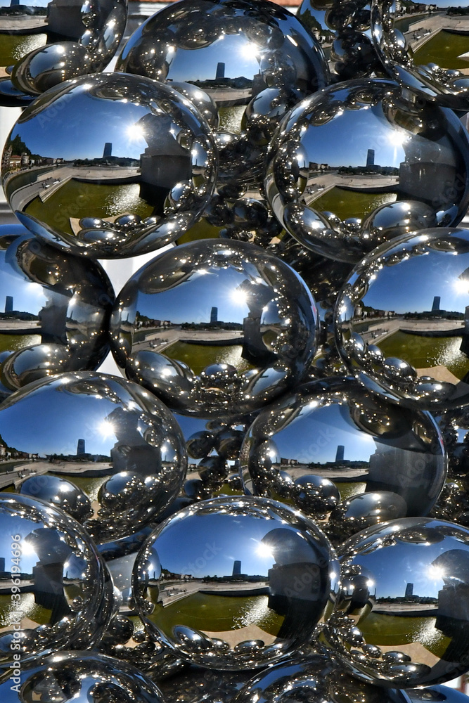 Abstract reflections off metallic spheres. Closeup of Tall Tree and the ...