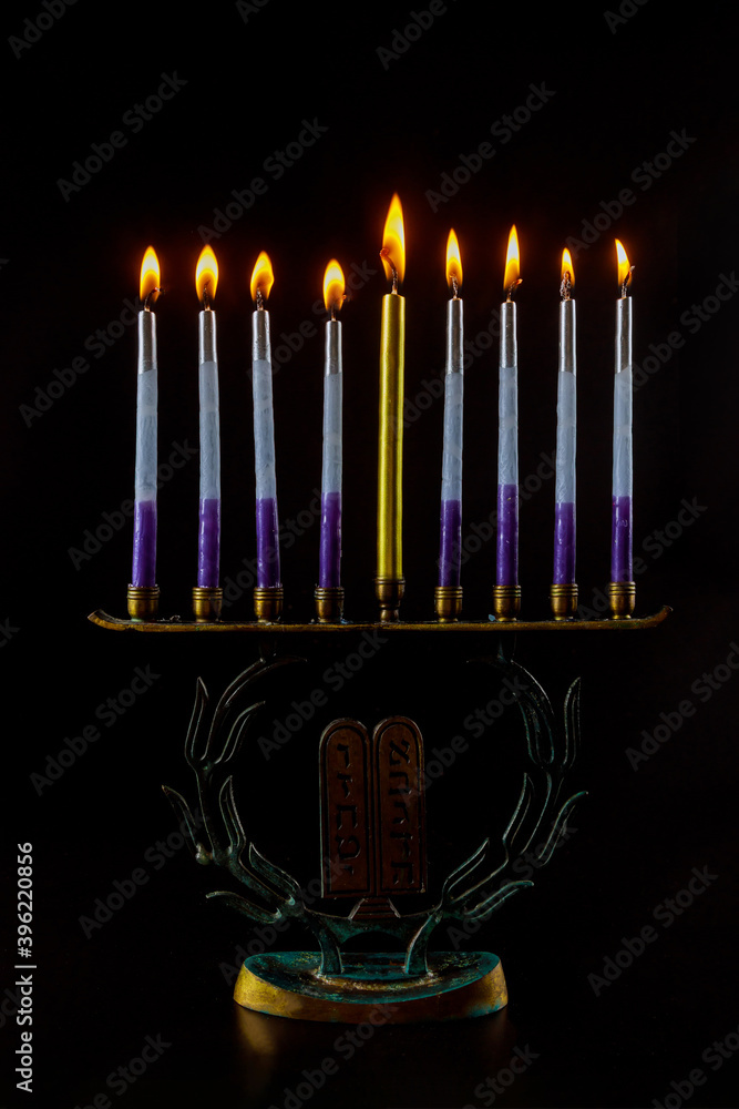 Hebrew Menorah of Hanukkah with burning candles is traditional symbol ...