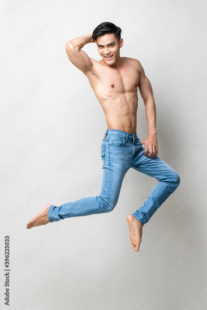 Full length portrait of energetic attractive shirtless Asian man ...