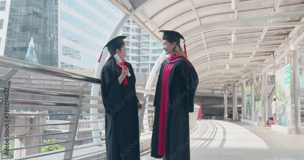 2 Student wearing graduation jacket celebrate success their learning at ...