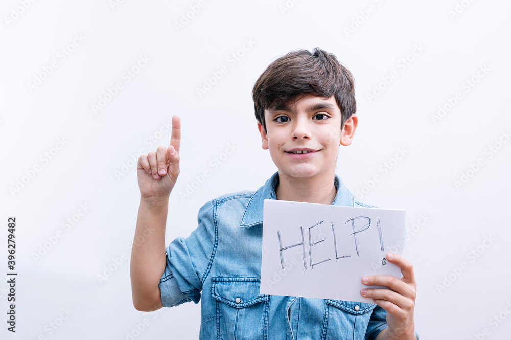 Young little boy kid holding paper sing with help message asking for ...