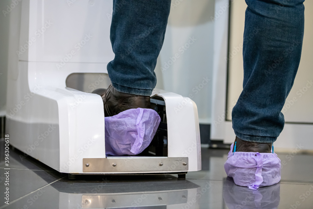 Automatic device for Shoe covers machine, close-up Stock Photo | Adobe ...