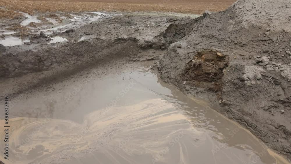 Dense, fluid, heavy and thick muddy water. Mud is soil, loam, silt or ...