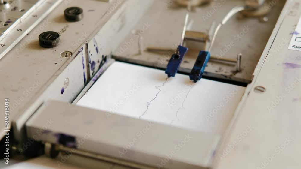 Lie detector, seismograph. A closeup view closeup pan of a polygraph ...