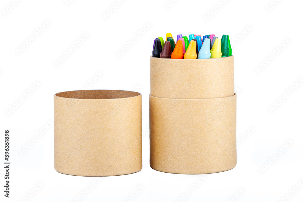 Colorful thin wax crayons set in an open eco friendly brown paper tube ...