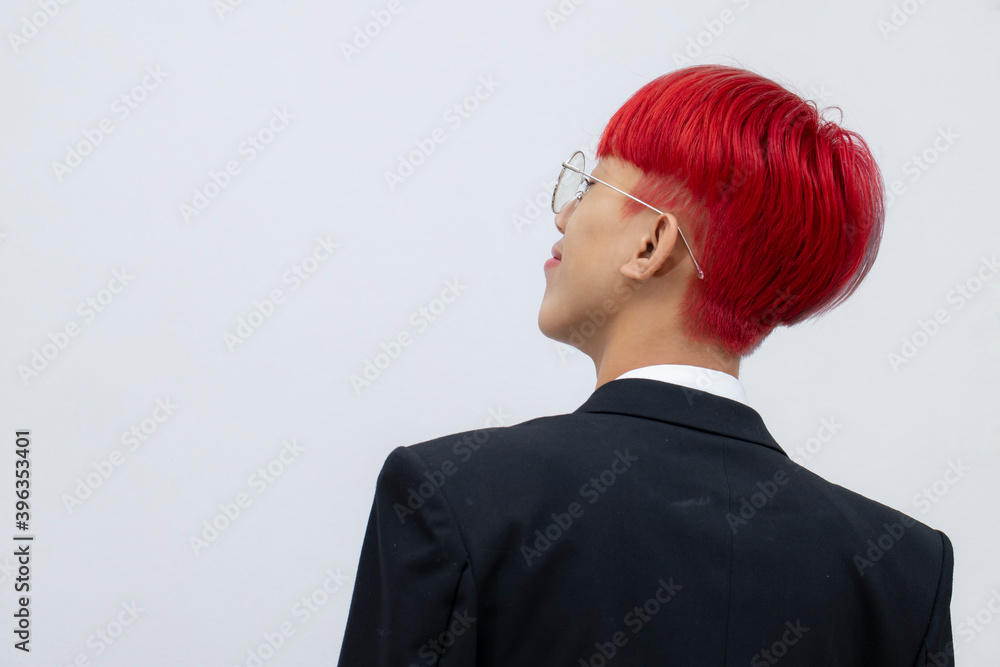 Portrait of a man with bright colored flying hair, all shades of red ...