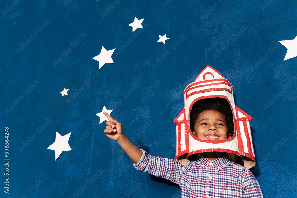 Zdjęcie Stock: Rocket boy, afro-american kid playing astronaut pointing ...