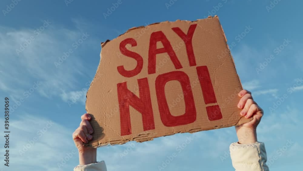 Say No! woman hands holding on cardboard background of blue sky sunset ...