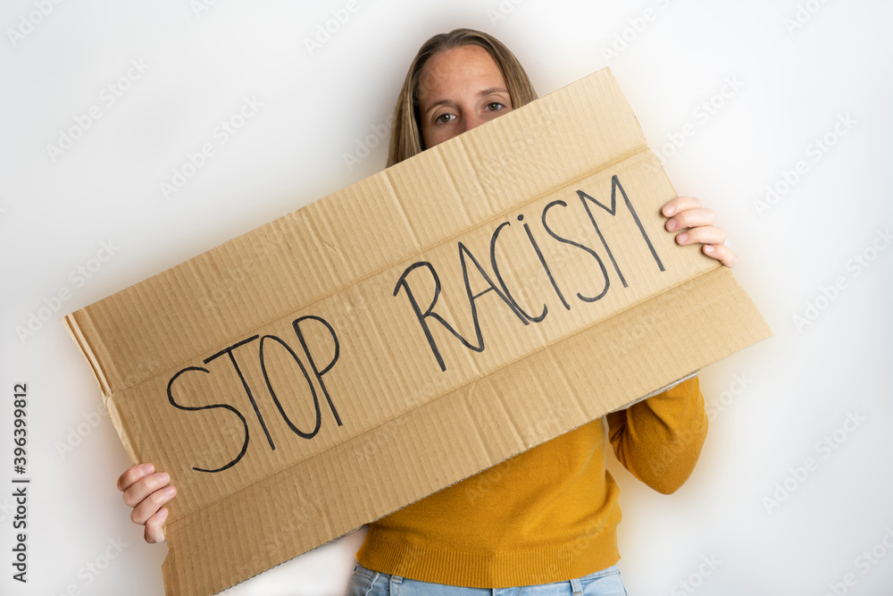 Young beautiful woman holding a protest poster with the text Stop ...