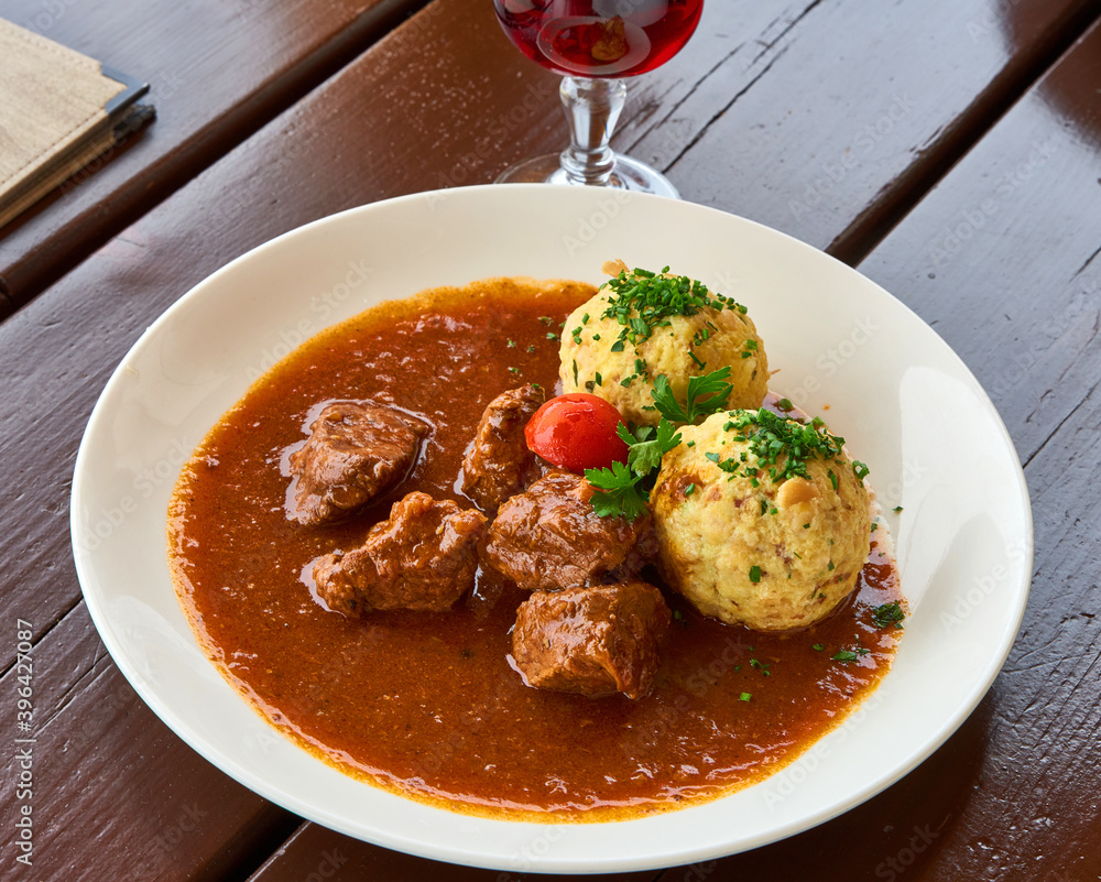 Traditional hot home made food in alpine rifugio in the Dolomite Alps ...