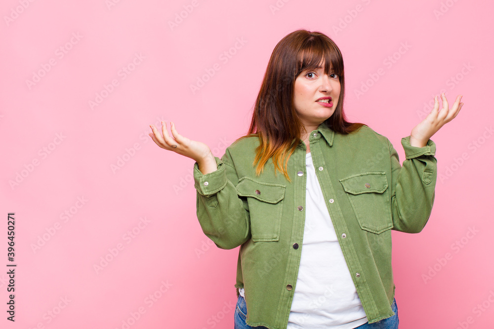 overweight woman shrugging with a dumb, crazy, confused, puzzled ...