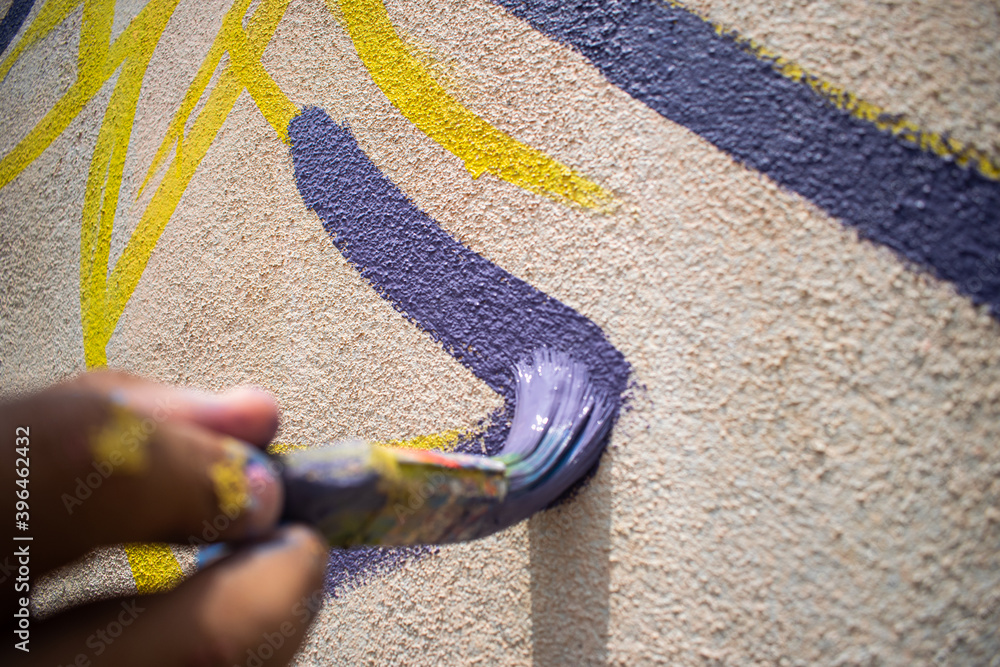 Pintando mural Stock Photo | Adobe Stock