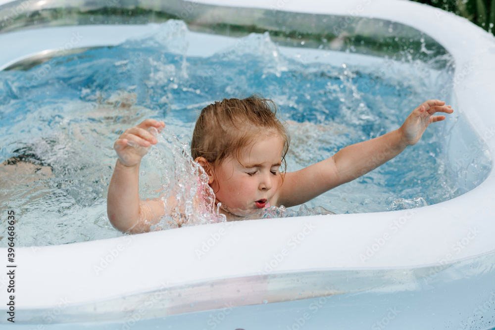 Little girl drowns in the home pool. Danger in the water. Baby bathes ...