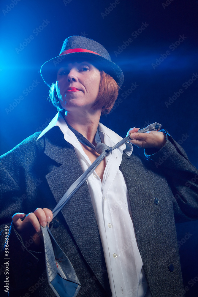 Portrait of ugle middle-aged woman with hat. Model posing in funny male ...