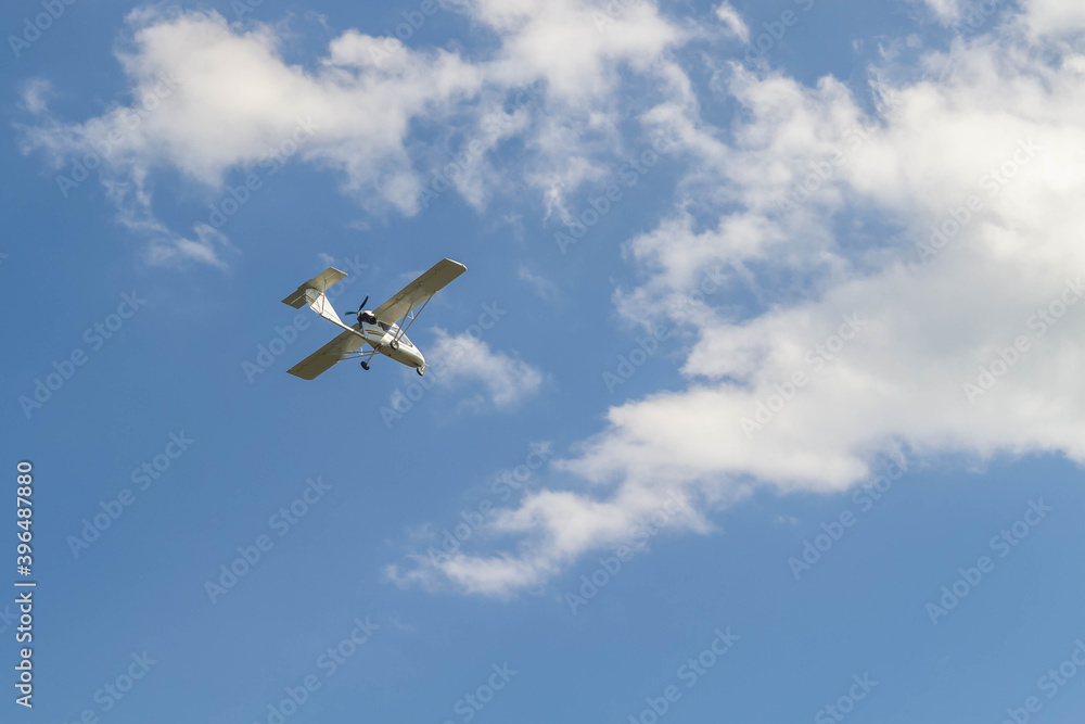Russian private jet flies high. Flying a small white plane in the sky ...