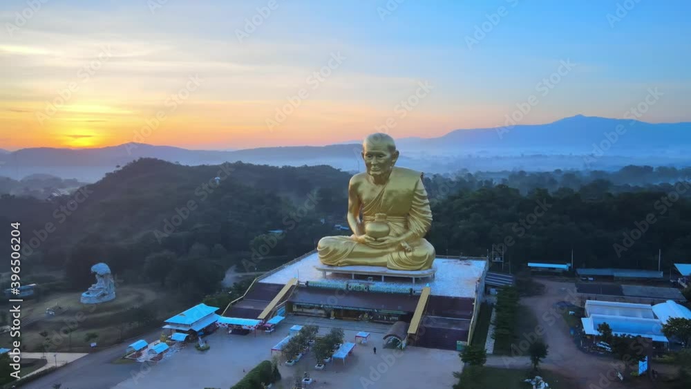 4k Slow wide panning around The golden image of the Luang Pu Thuat, the ...