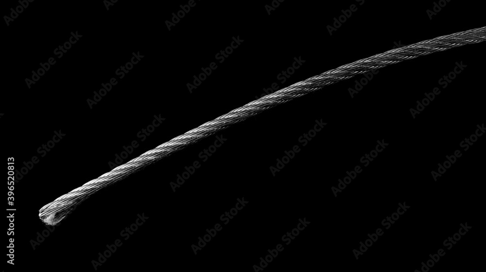 Steel cable, braided wire rope isolated on black background with ...