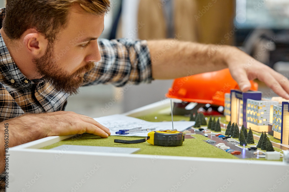 young student architect working on architectural project concept, using ...