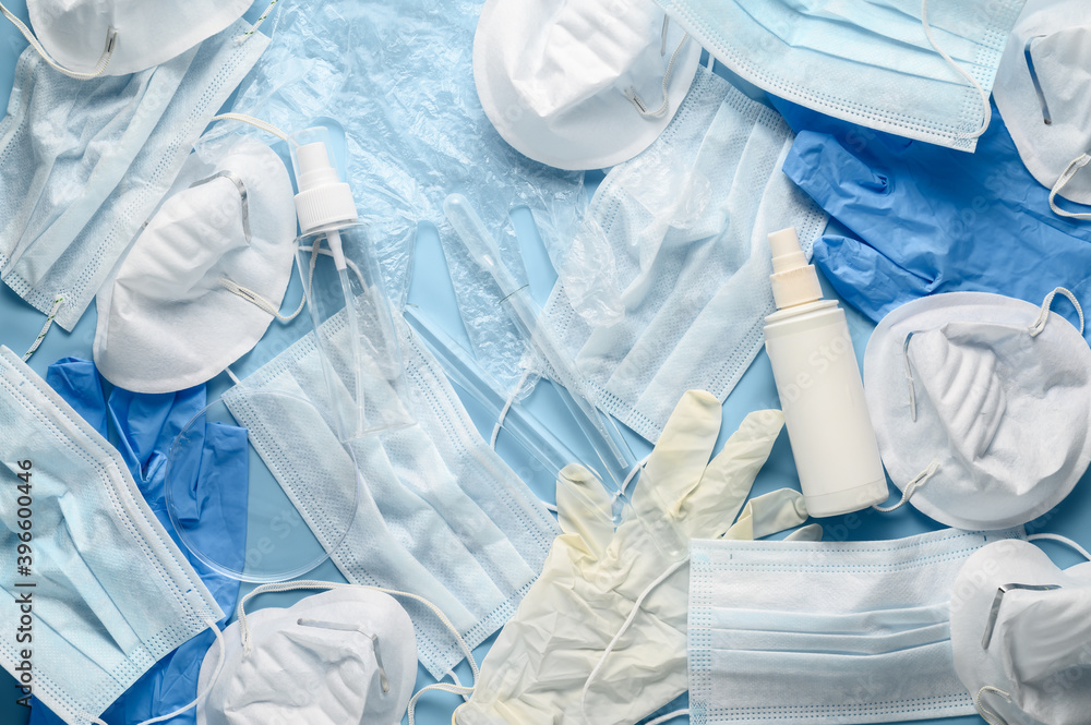 Used disposable medical face masks, latex gloves, syringes, test tubes ...