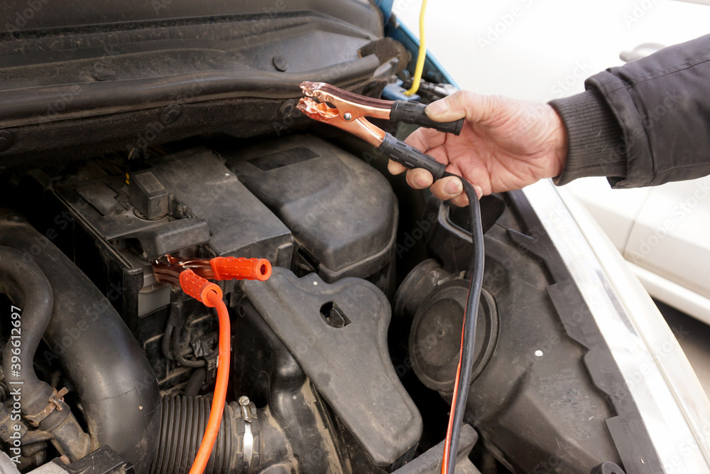 Starting a car with a dead battery using an external power source and ...