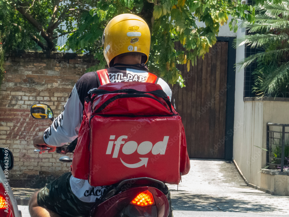 São Paulo, Brazil - December 1, 2020: biker from Ifood company delivers ...