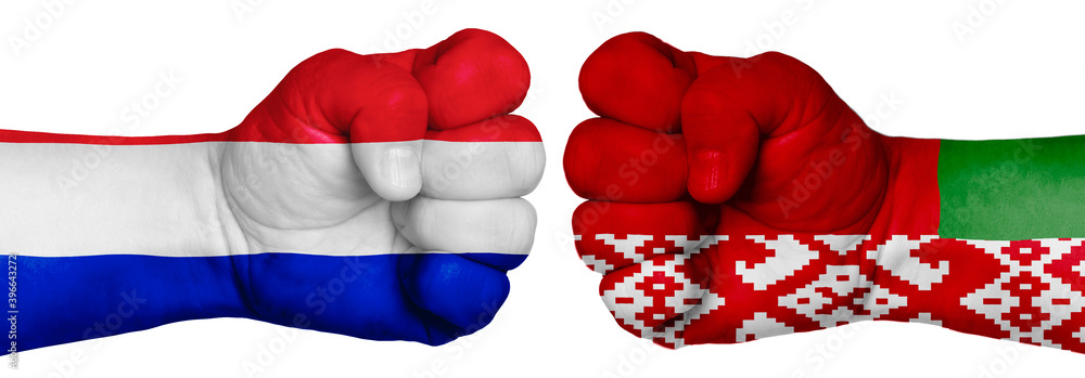 Two hands are clenched into fists and are located opposite each other ...