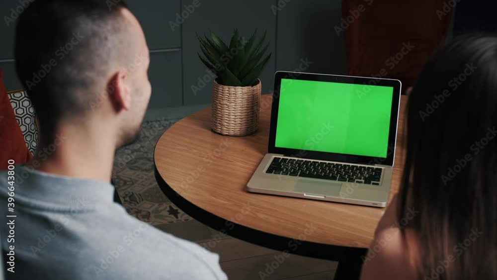 Young Man and Woman at Home office business Using Green Mock-up Screen ...