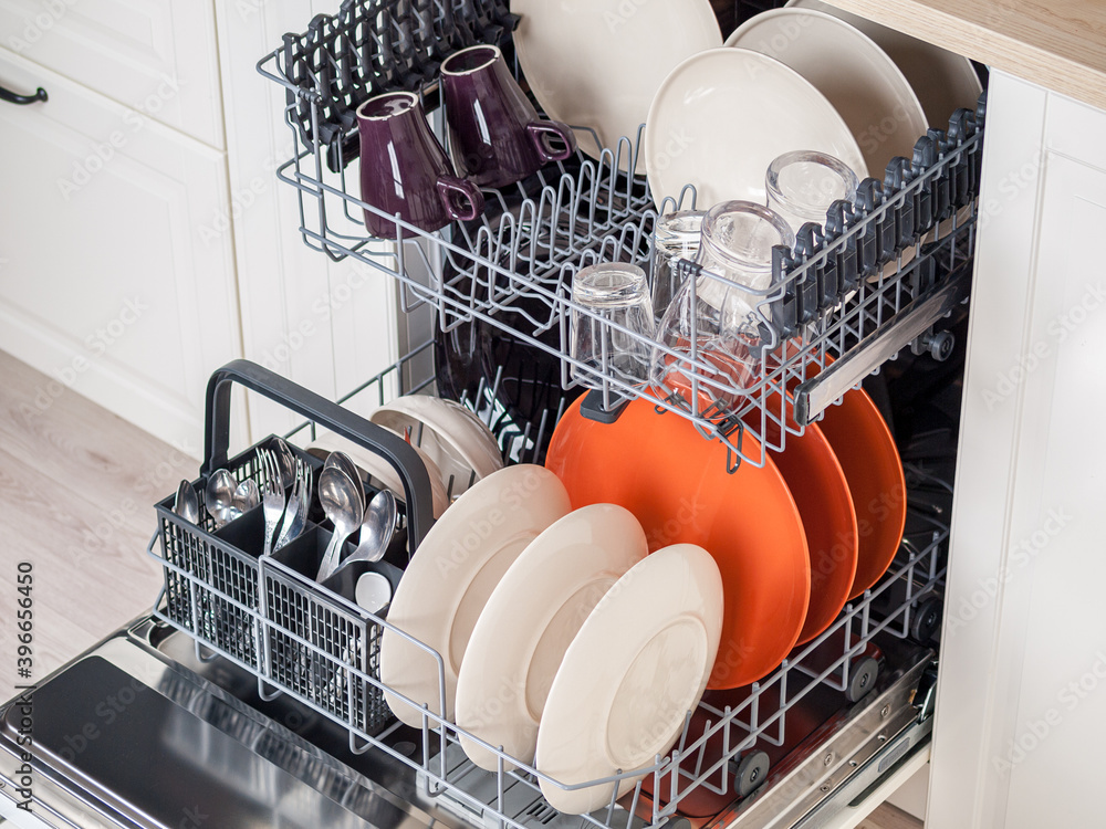 dishwasher close-up with washed dishes, easy to use and save water, eco ...