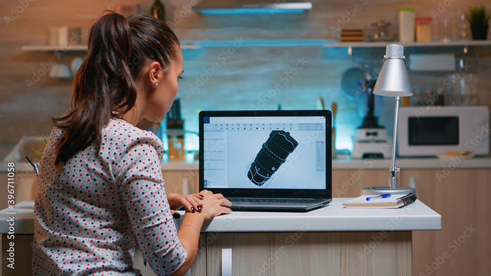 Designer engineer analizing new prototype of 3D model of the plant ...