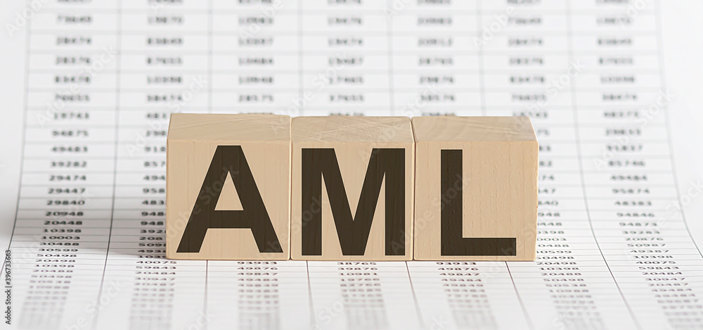 Money laundering concept, wooden word block AML on the chart Stock ...